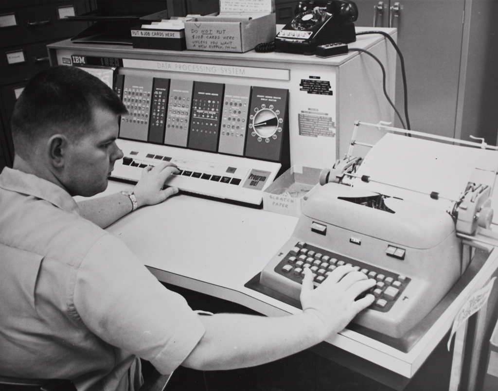 A man utilizing an IBM 1620 Data Processing System at California State ...